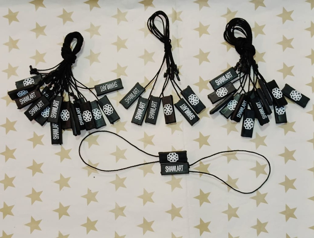 PLASTIC SEAL TAG IN NEW DELHI Our" SHAWLART" logo ... | Woven Label ...
